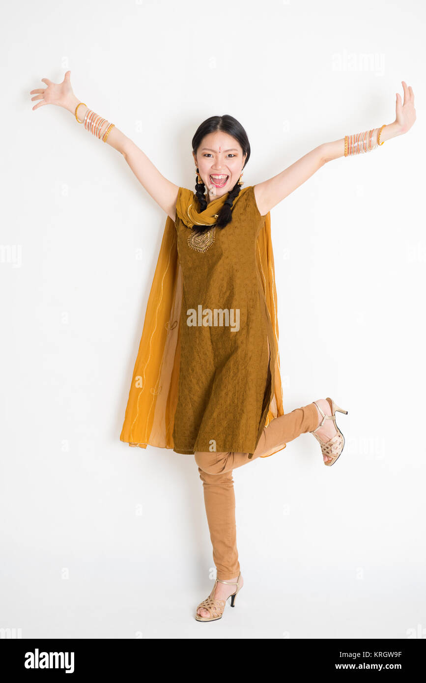 Excited Indian Chinese female arms raised Stock Photo - Alamy