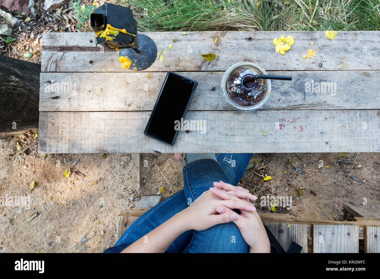 relax time with mobile phone and cold drink on wooden table lifestyle ...