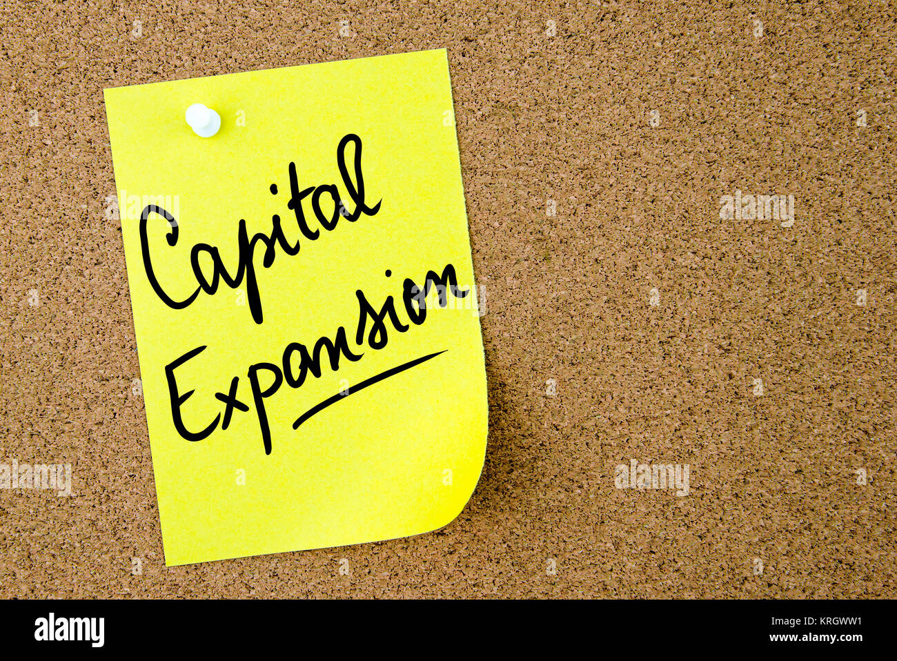 Capital Expansion text written on yellow paper note Stock Photo - Alamy