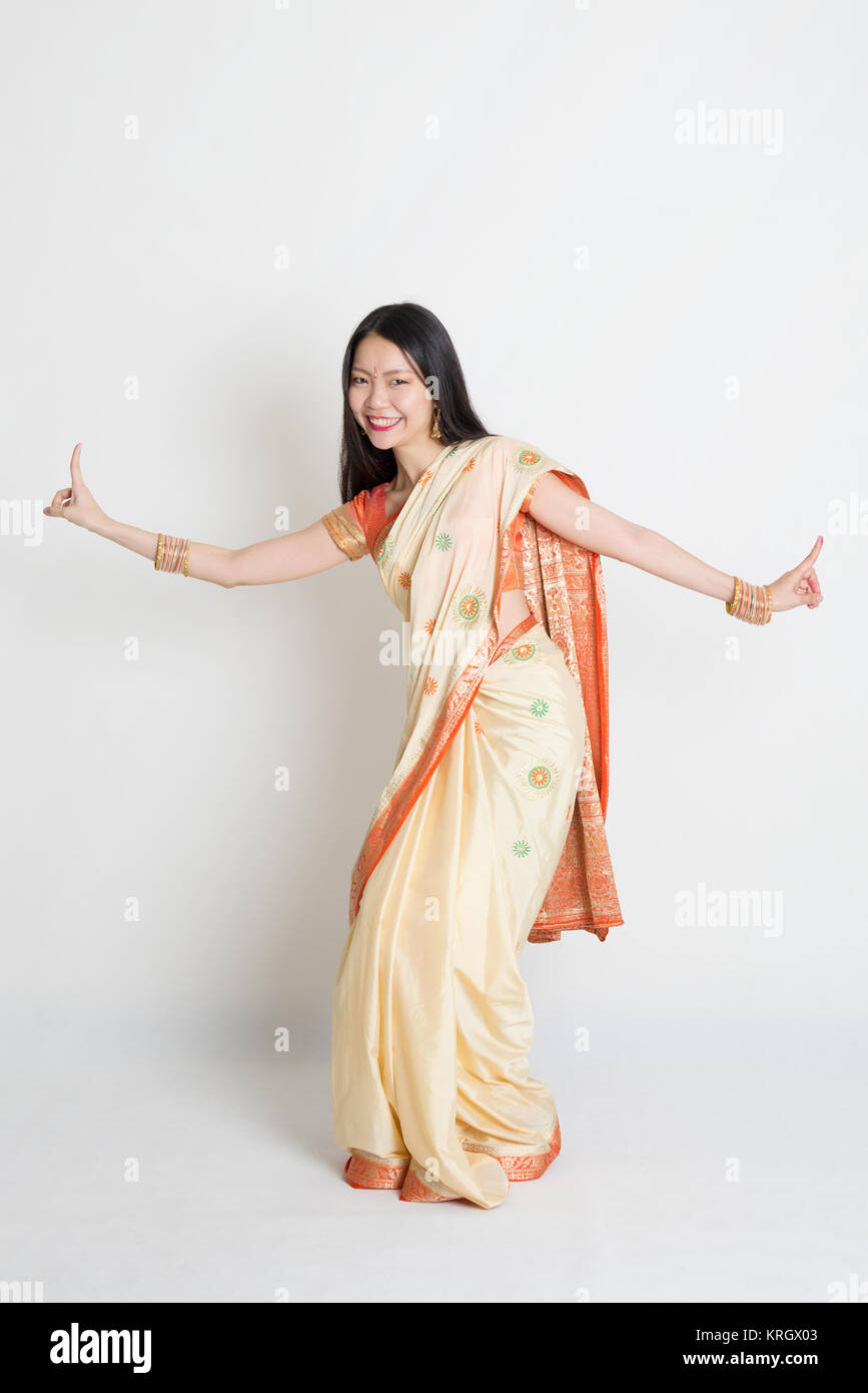 Female in Indian sari dress dancing Stock Photo - Alamy