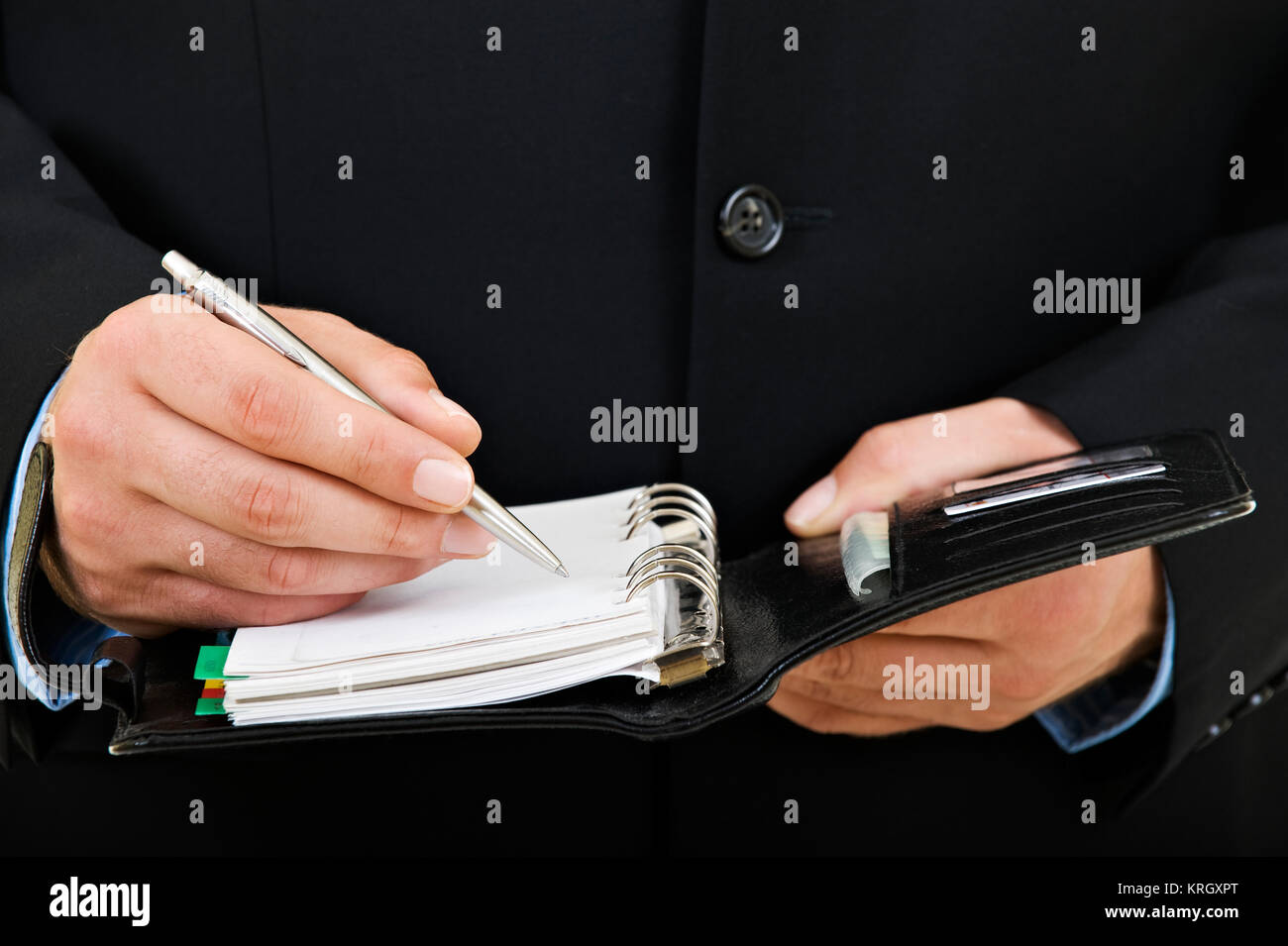 Businessman taking notes Stock Photo - Alamy