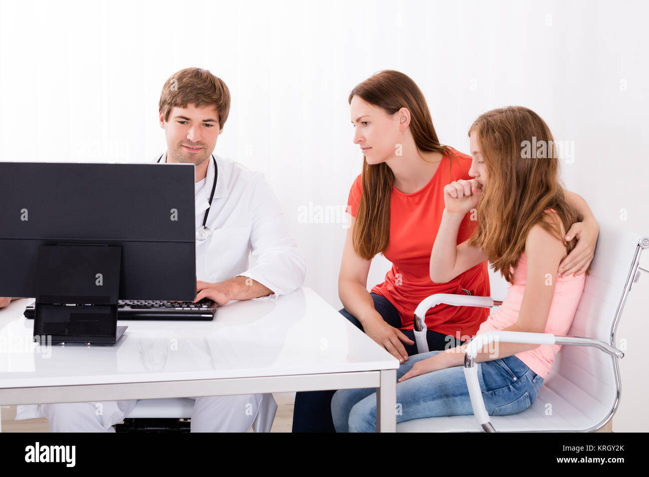 Doctor Showing Result To Patient On Computer Stock Photo - Alamy