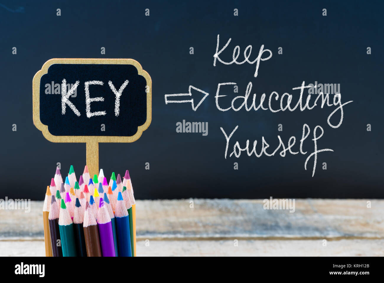 Business Acronym KEY Keep Educating Yourself written with chalk on ...