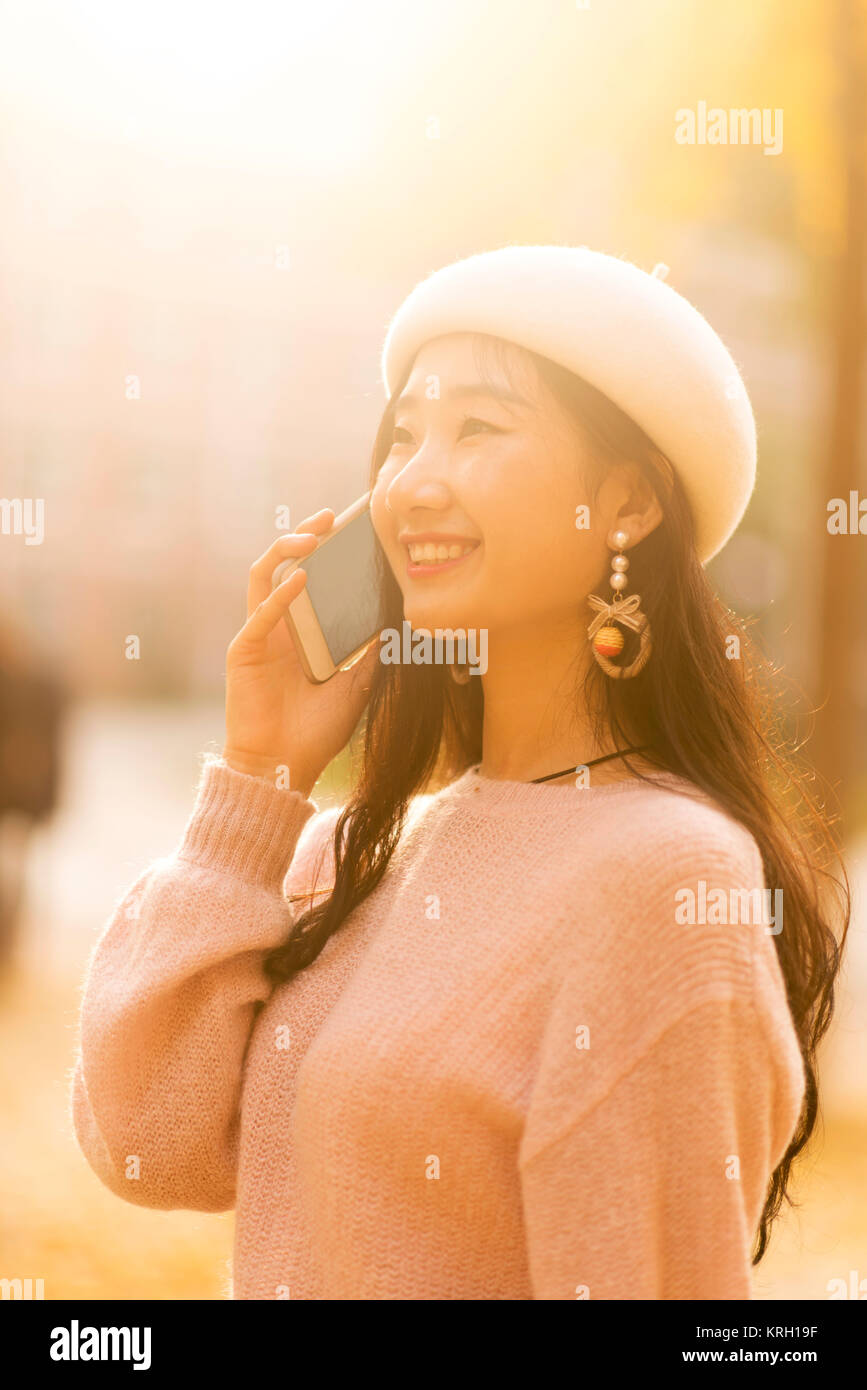 Teenage Girl Making Mobile Phone Call In Autumn Landscape Stock Photo ...