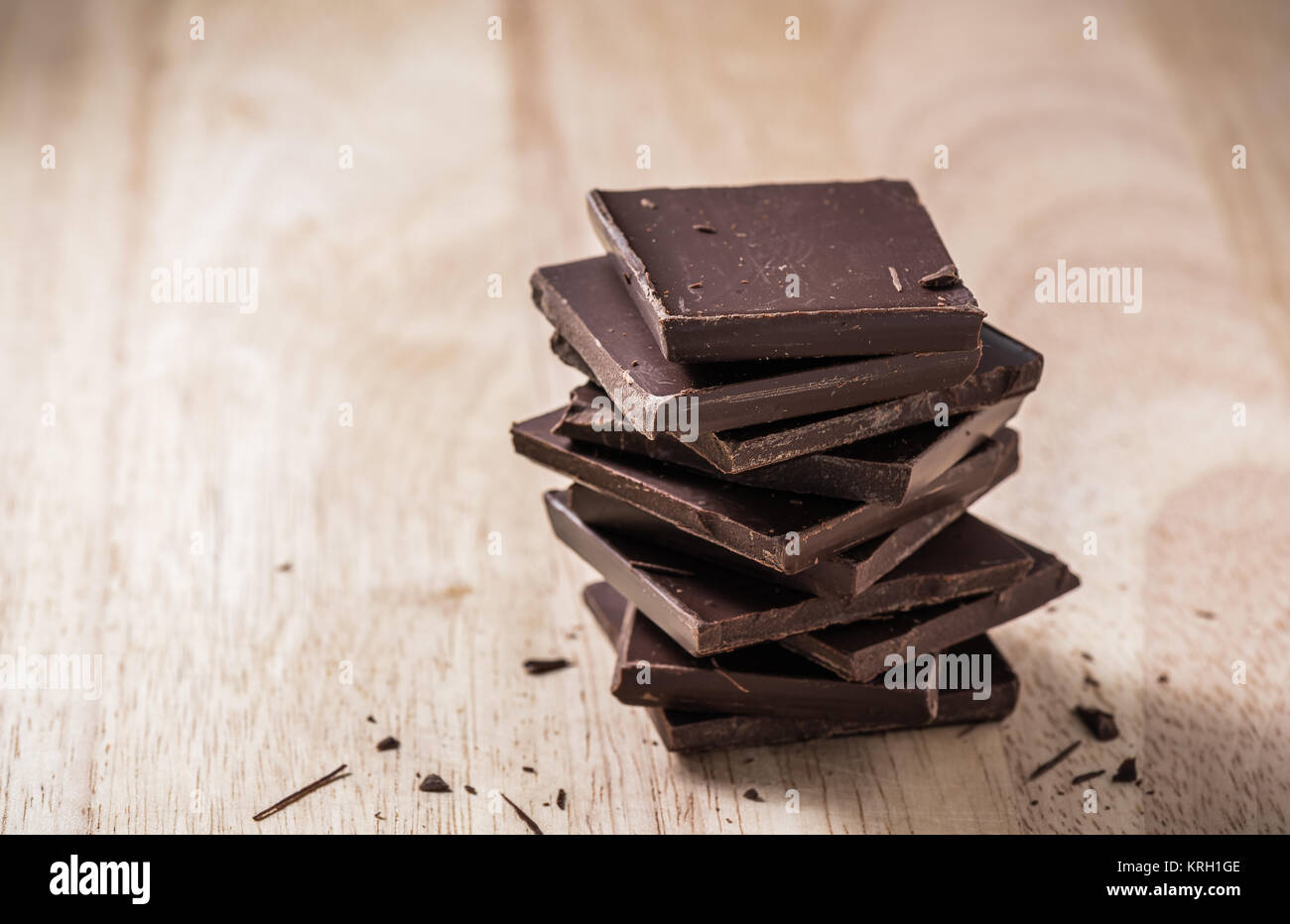 Chocolate Bars Stack on Wooden Table Stock Photo - Alamy