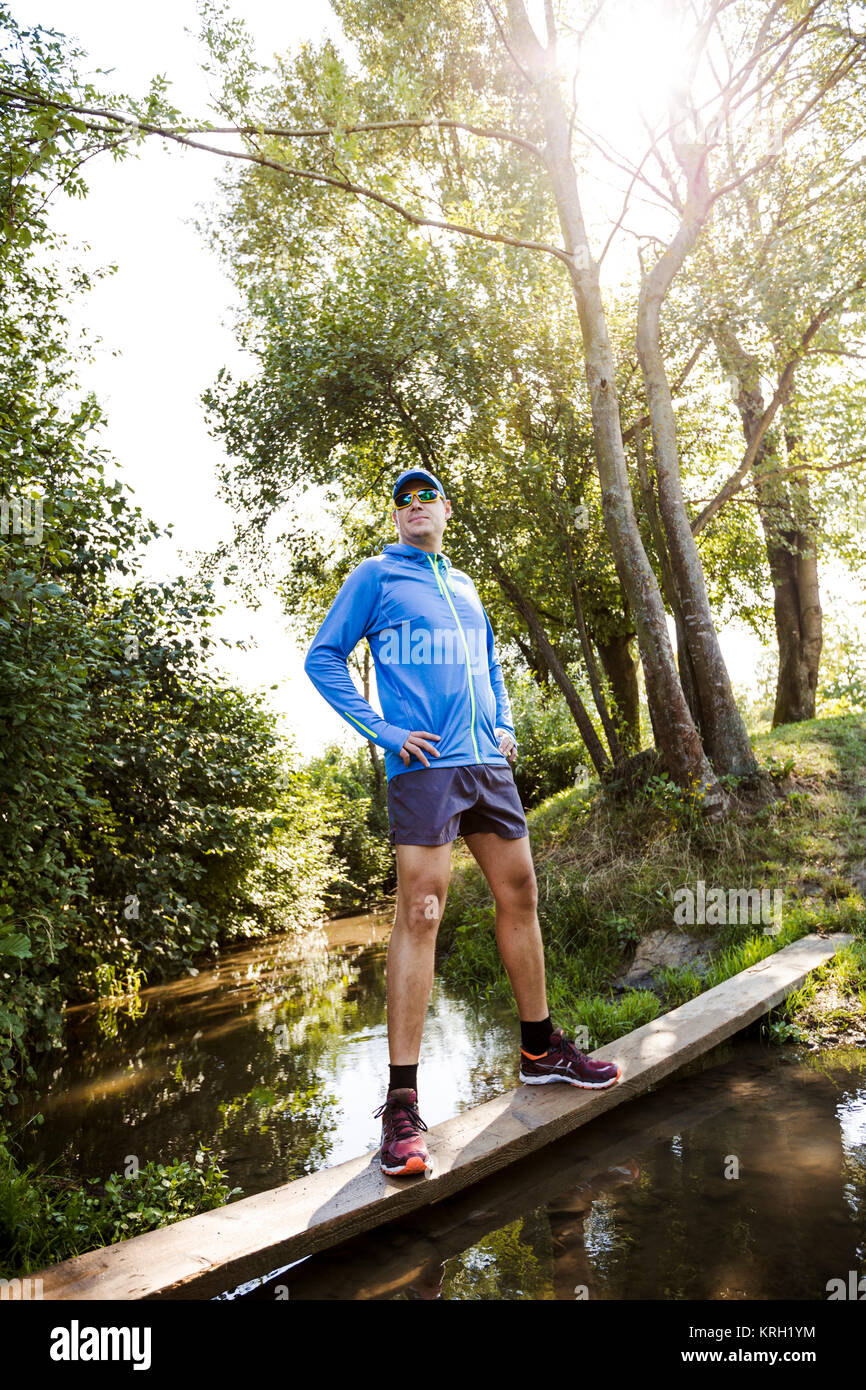 young man jogging at the woods Stock Photo - Alamy