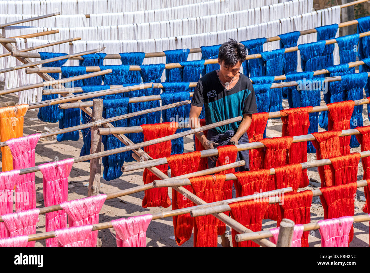 People and Colorful cotton yarn drying on a stick , in Myanmar , Asia ...