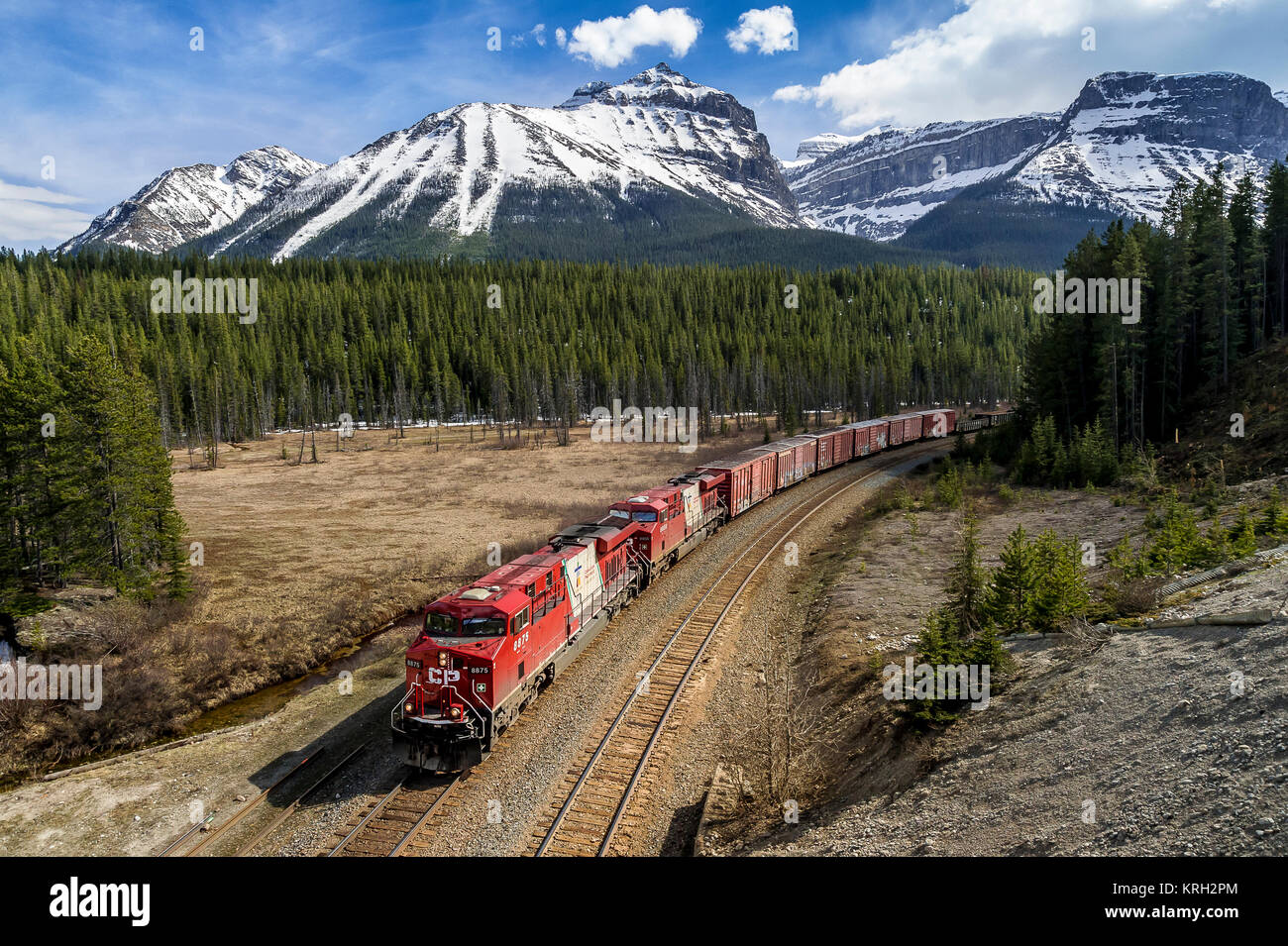 CP Rail Olympic locos 8875 and 8858 lead manifest freight on south track down from Kicking Horse ...