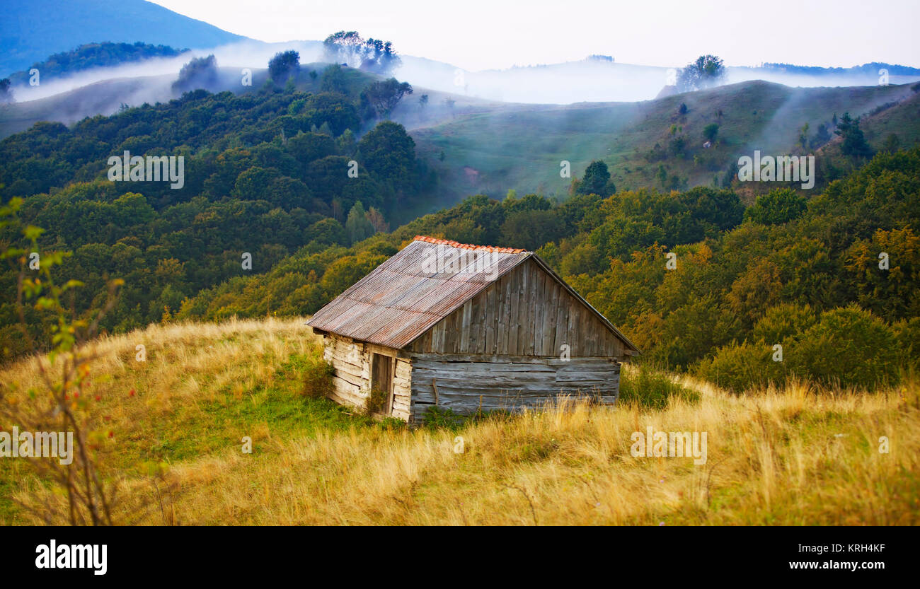 Wooden cottage in the mountains Stock Photo - Alamy