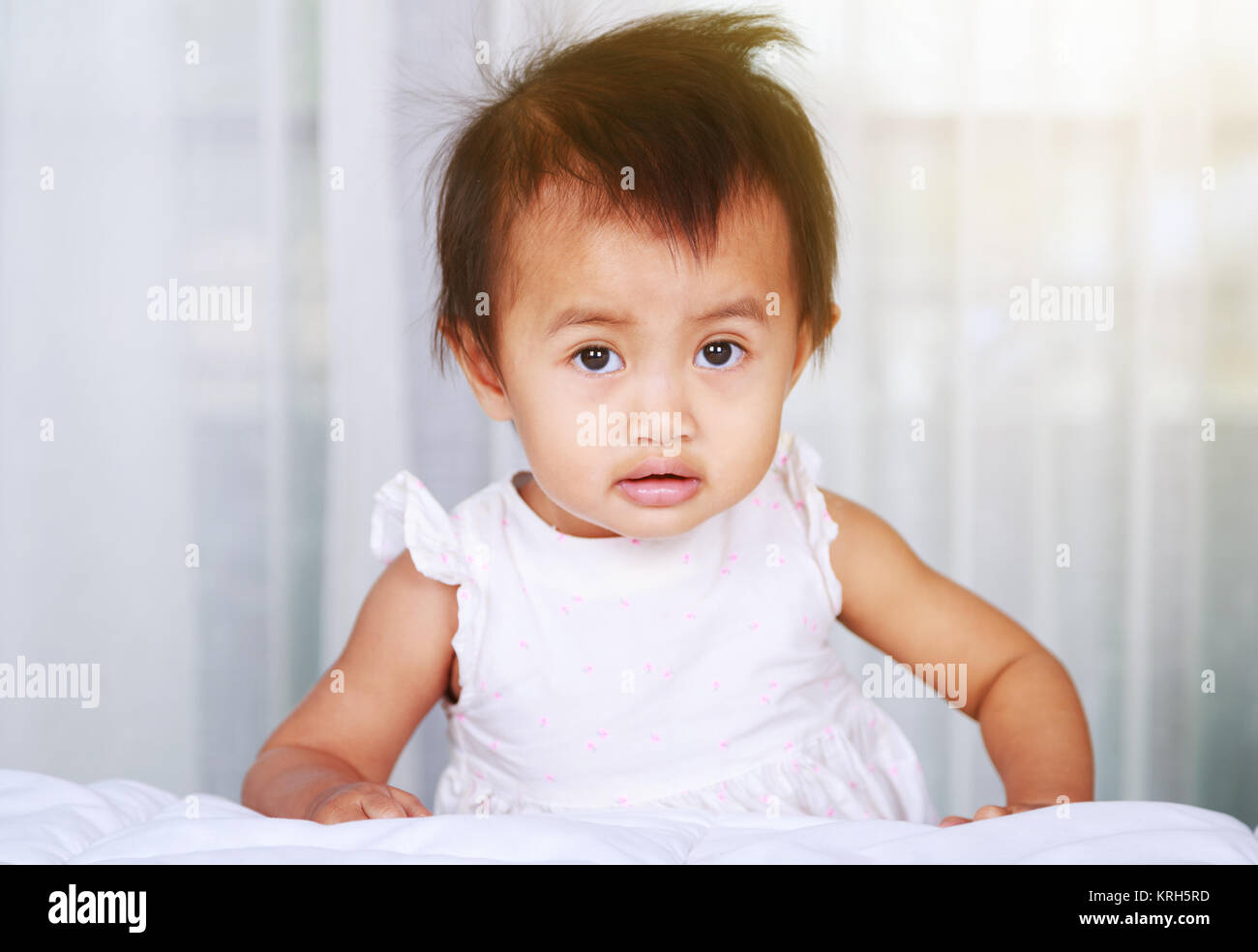 portrait of baby near the window at home Stock Photo - Alamy
