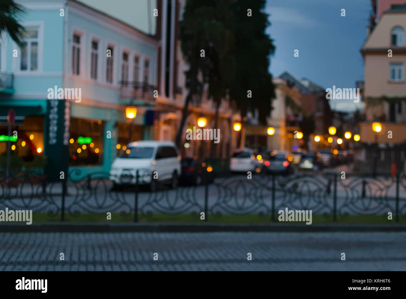 Blurred photo of small city street in the summer evening - stuck lights ...