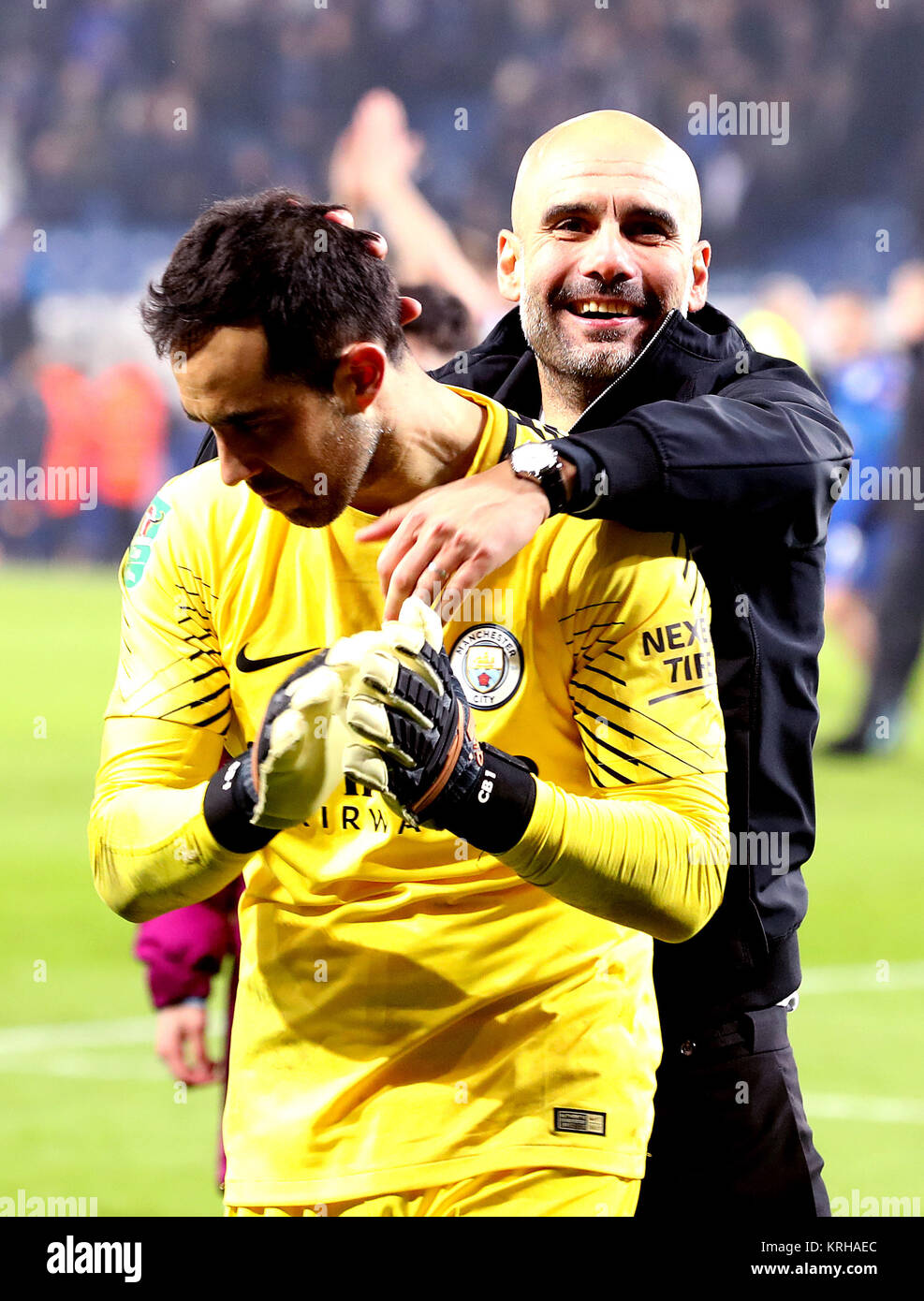 Manchester City manager Pep Guardiola (back) celebrates with Manchester ...