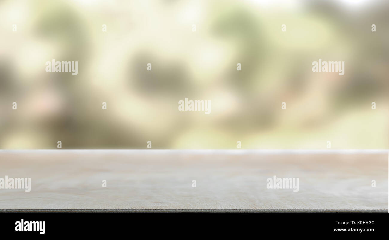Wooden surface on the background of blurred scenery outside the window ...