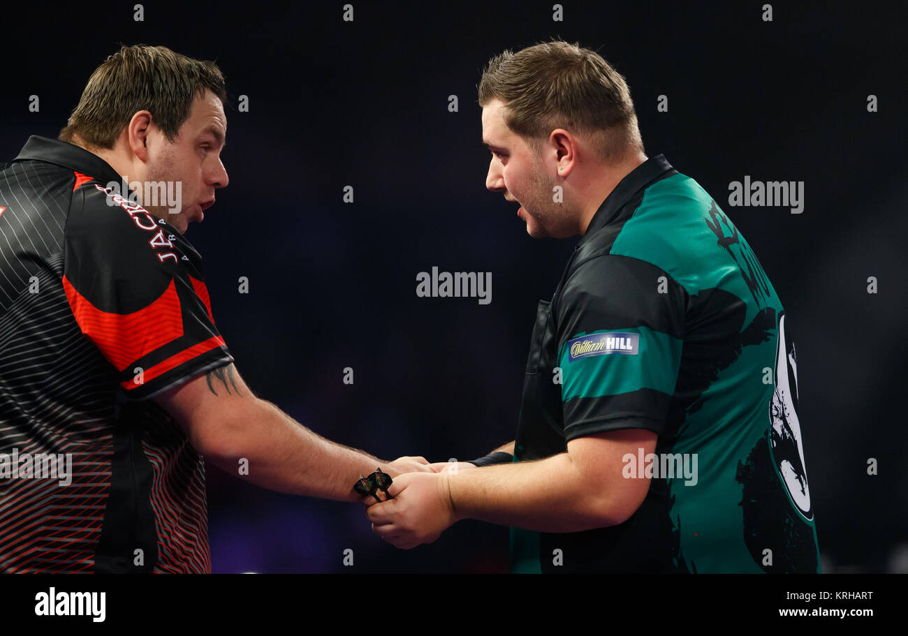 Adrian Lewis, left offers his congratulations to the winner Kevin Munch ...