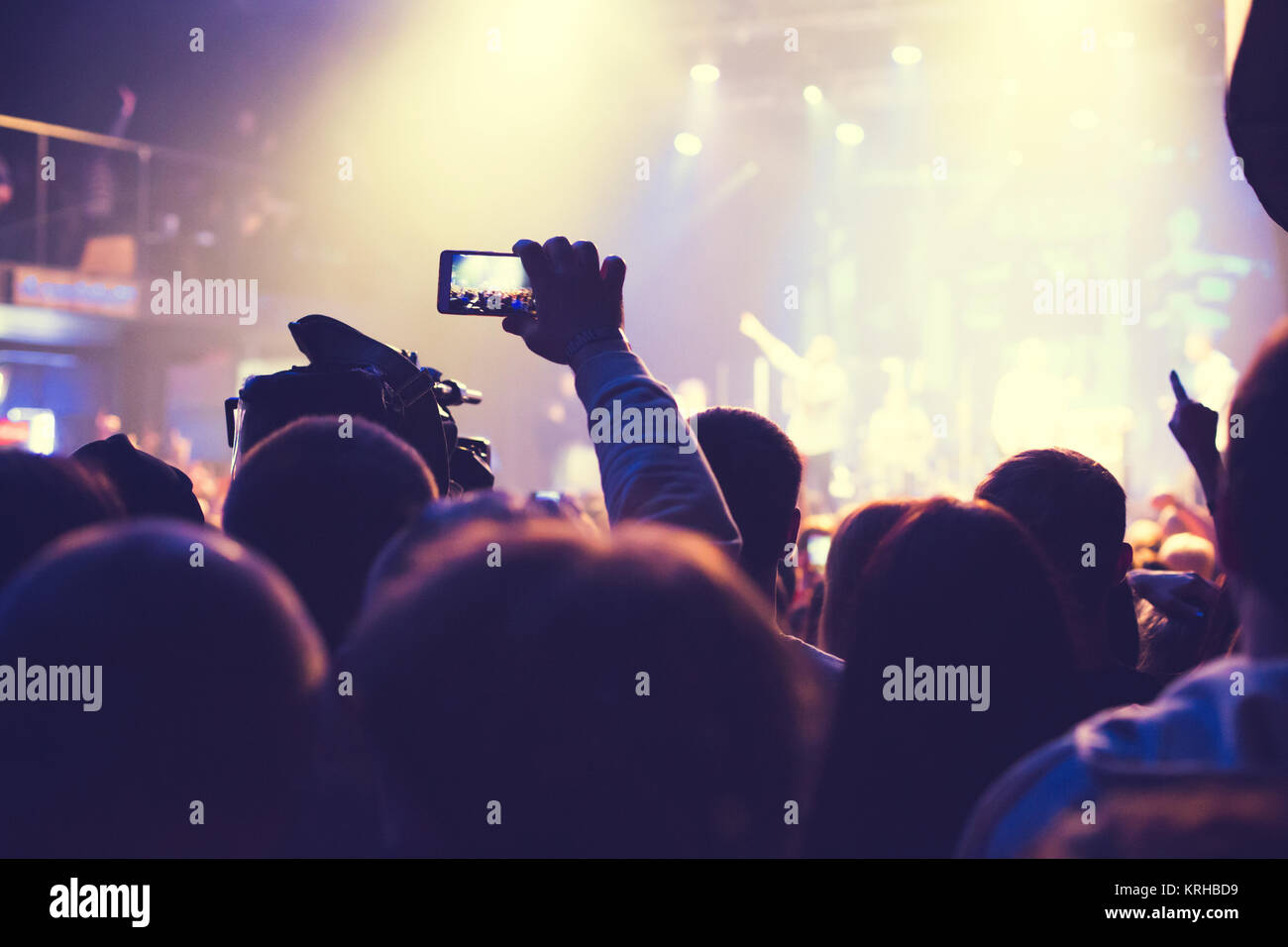 The audience watching the concert on stage Stock Photo - Alamy
