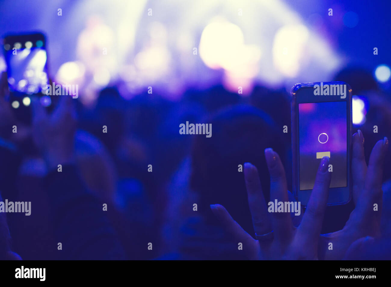 The audience is videotaping on the smartphone Stock Photo - Alamy