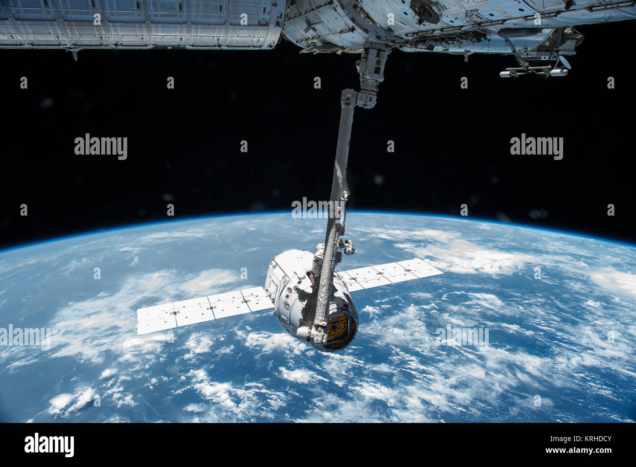 ISS-43 Canadarm2 robotic arm grapples SpaceX Dragon CRS-6 Stock Photo ...