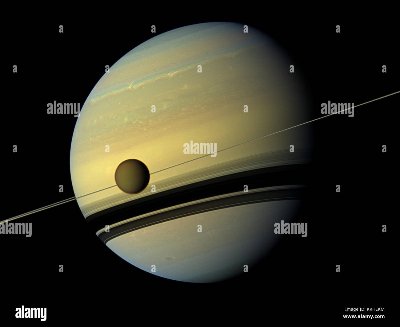 Titan in front of the ring and Saturn (cut Stock Photo - Alamy