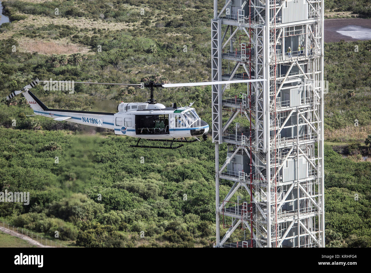 NASA UH-1 22Huey22 helicopter flies past the Mobile Launcher Stock ...