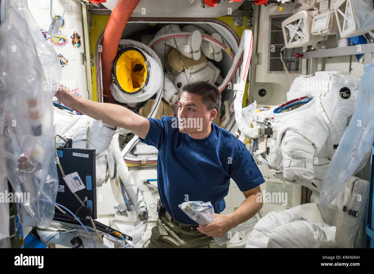 ISS-44 Kjell Lindgren in the Quest airlock Stock Photo - Alamy