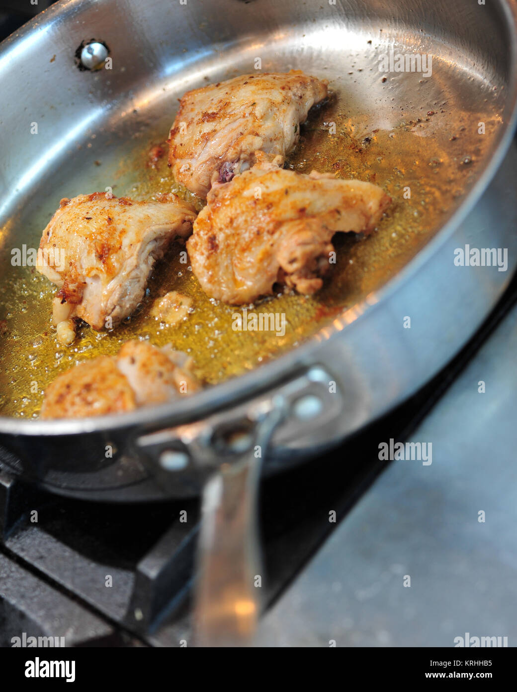 Sautéed chicken pieces in a sautée pan Stock Photo - Alamy