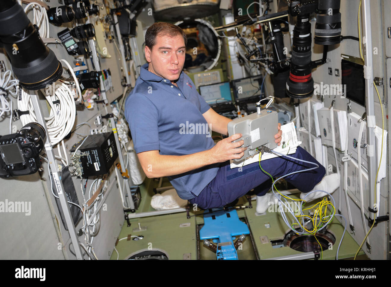 ISS-45 Sergey Volkov works inside the Zvezda Service Module Stock Photo ...