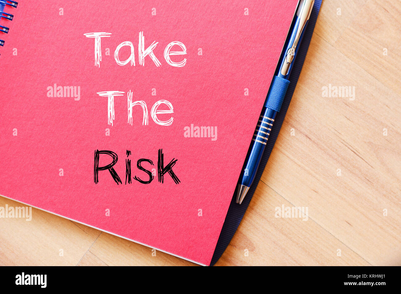 Take the risk text concept on notebook Stock Photo - Alamy