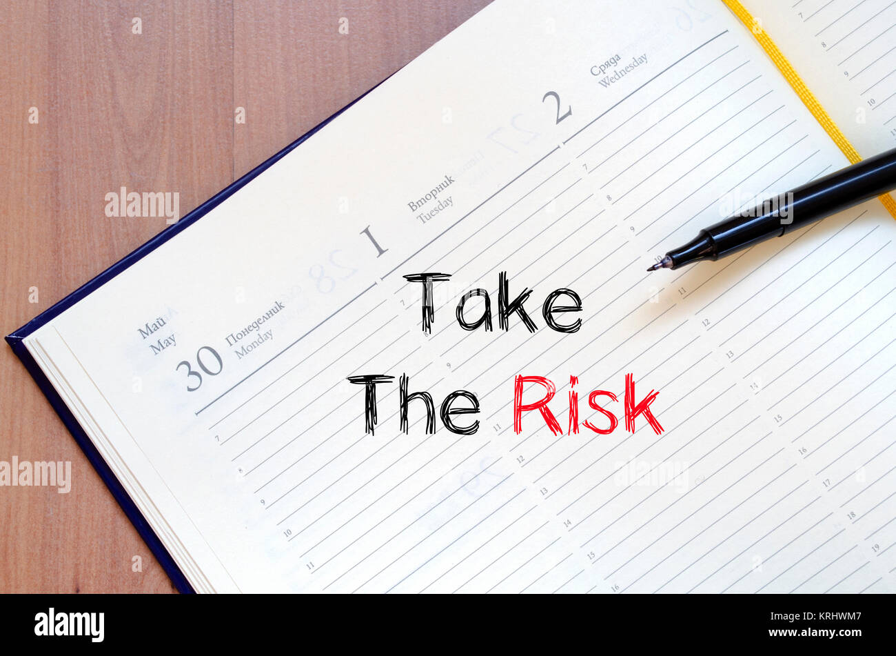 Take the risk text concept on notebook Stock Photo - Alamy