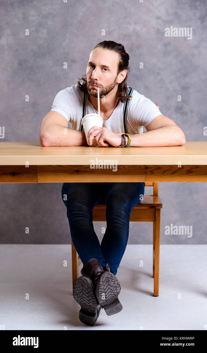 young man drinking soft drink Stock Photo - Alamy