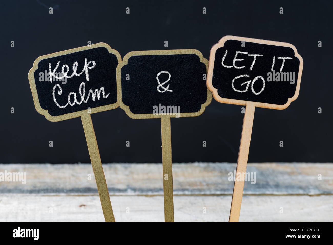 Keep Calm and Let It Go message written with chalk on mini blackboard ...