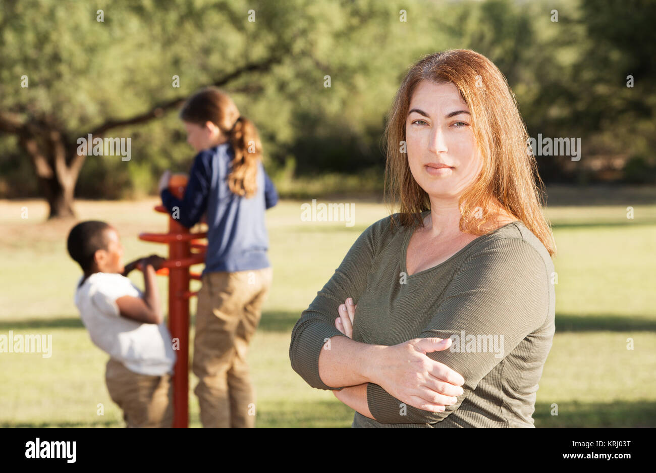 Confident single mother with children playing Stock Photo - Alamy