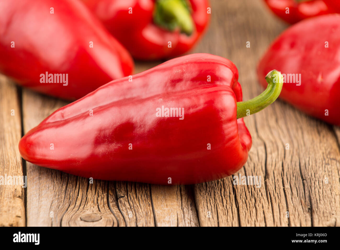 Pepper on the old wooden table Stock Photo - Alamy