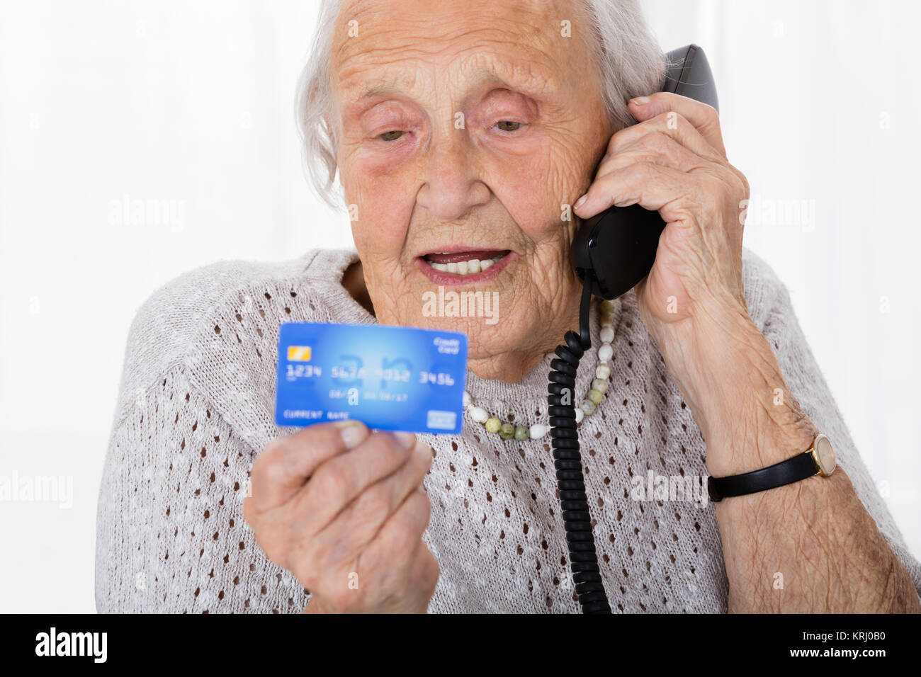 Worried woman answering phone call hi-res stock photography and images ...