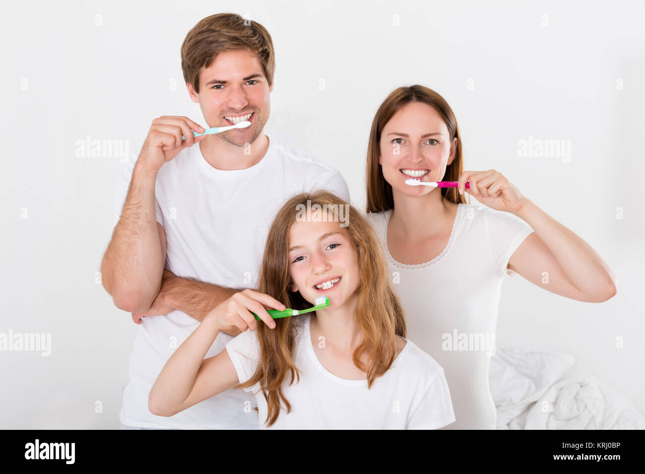 Family Brushing Teeth Together Stock Photo - Alamy