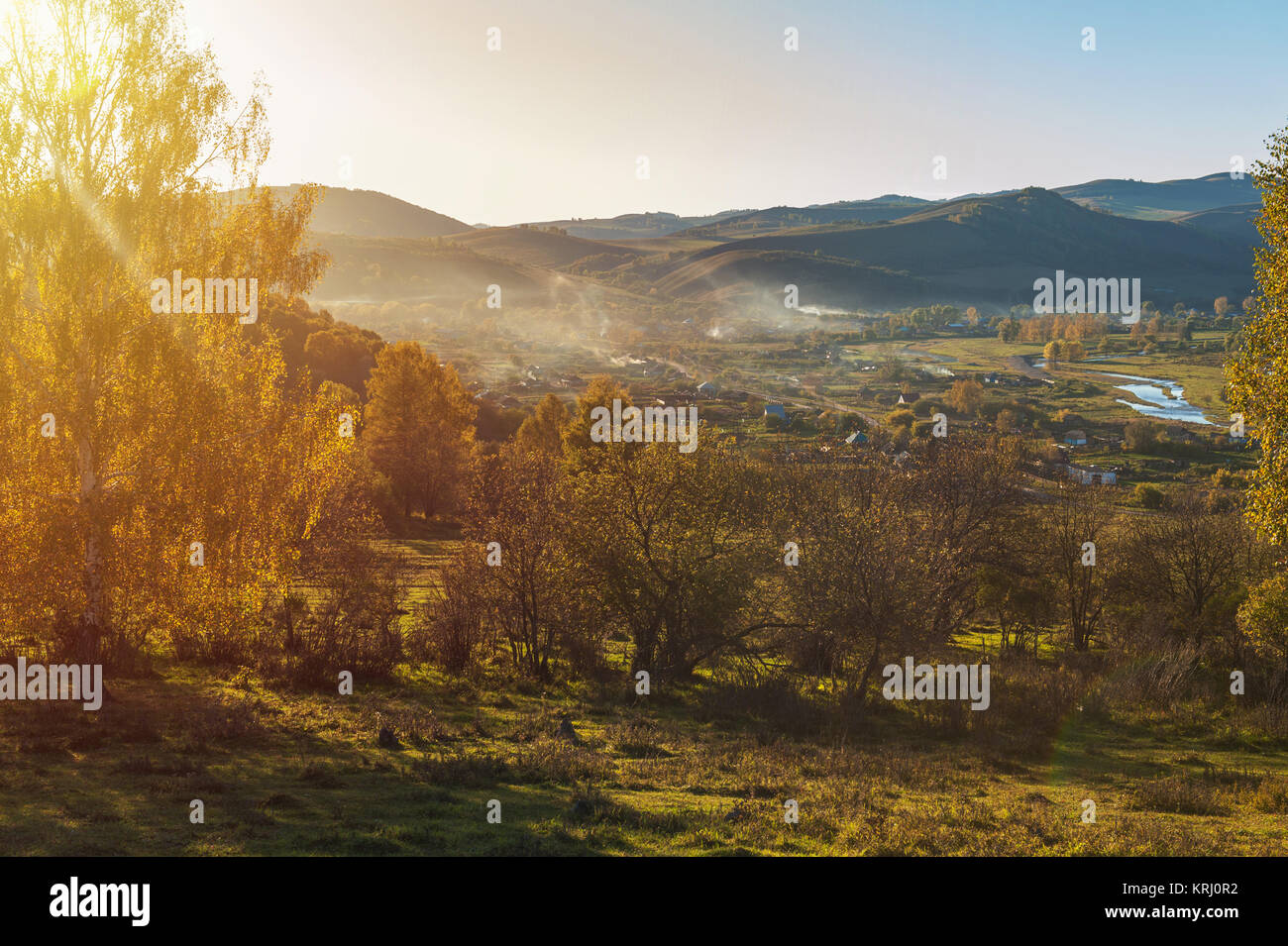 Village landscape in the evening Stock Photo - Alamy