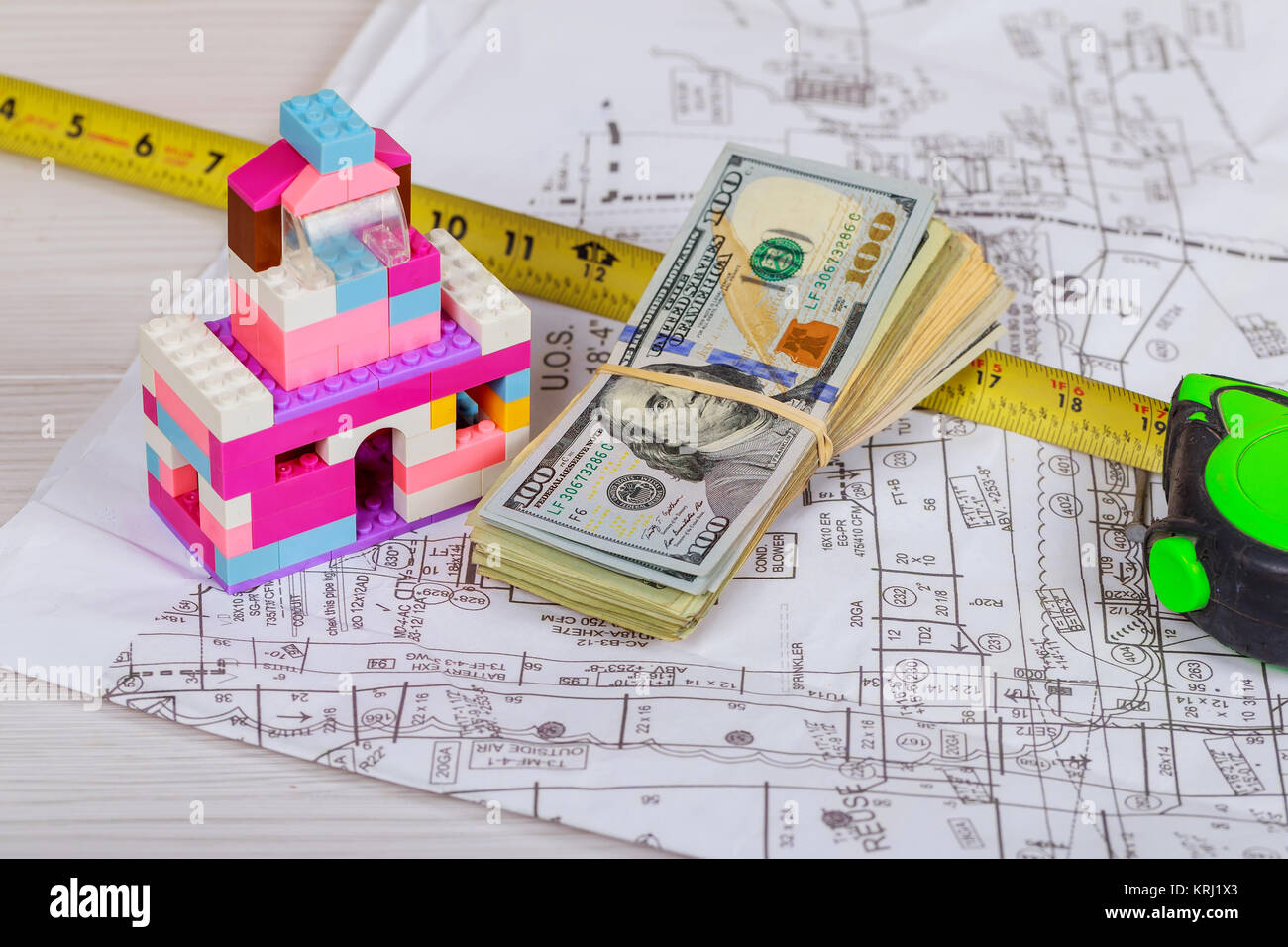 engineer working table plan and blueprint at building construction site ...