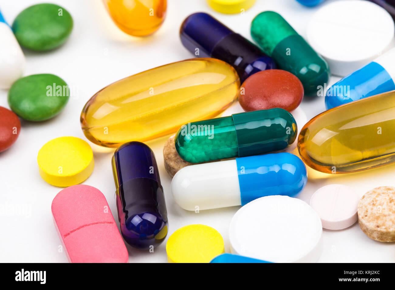 Various color pills and capsules macro shot Stock Photo - Alamy