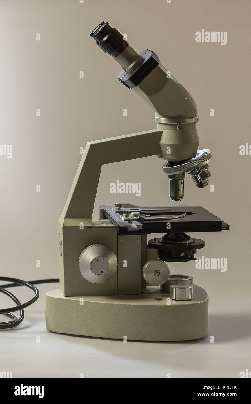 microscope with two eyepieces and cross table Stock Photo - Alamy
