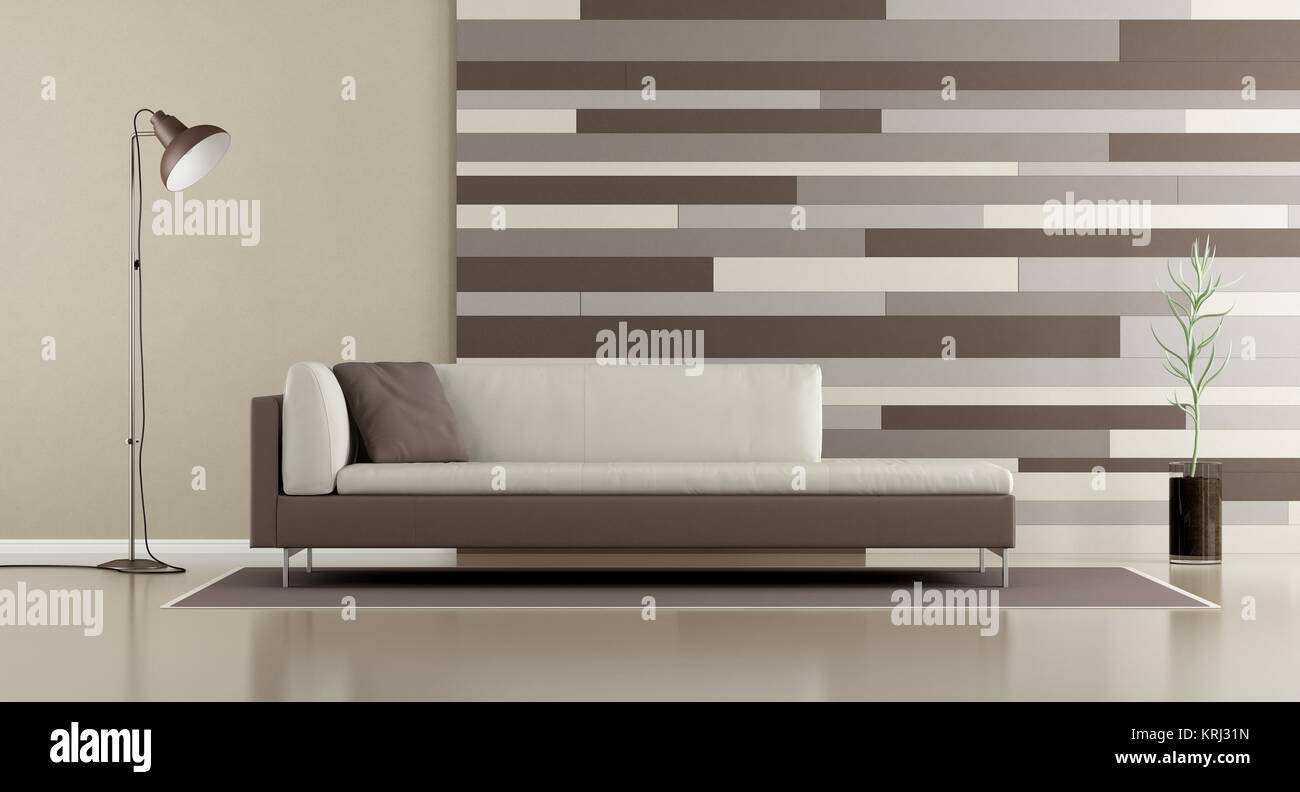 Contemporary lounge with sofa and decorative panel Stock Photo - Alamy