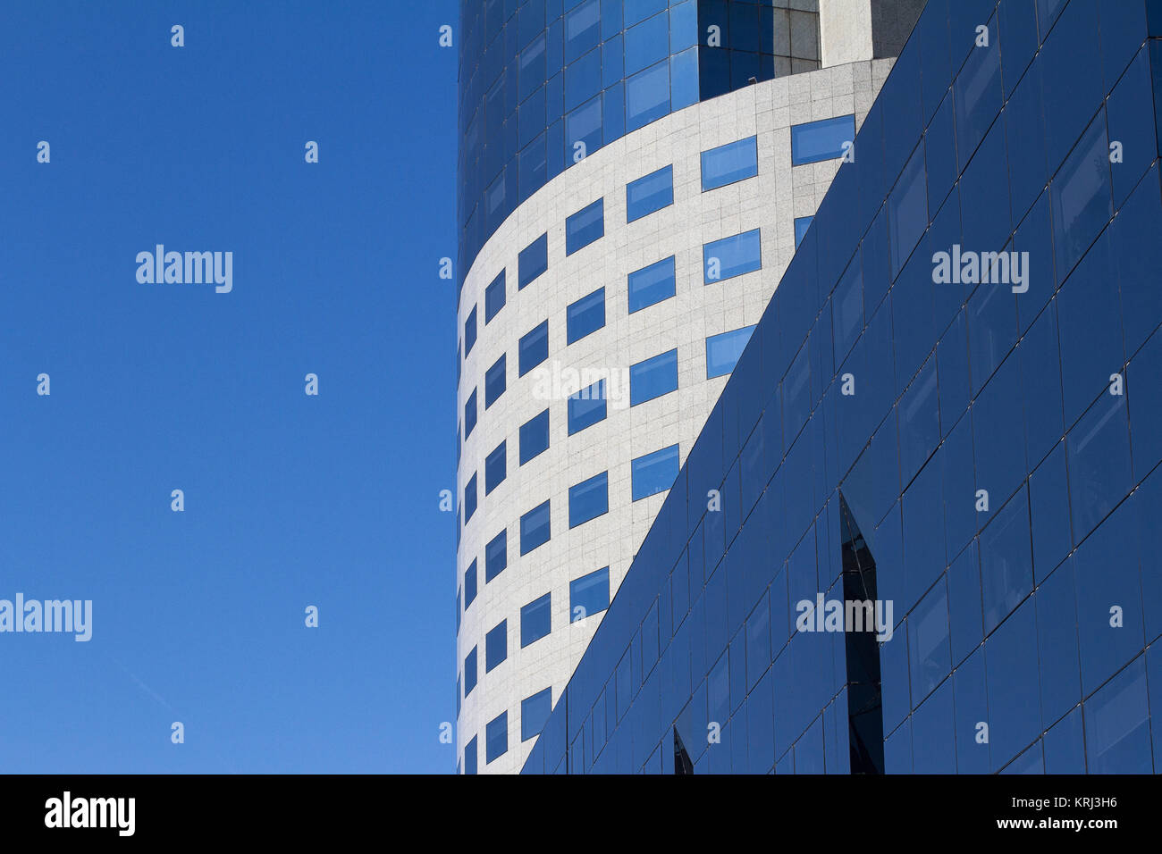 Round office building with concrete and glass windows Stock Photo - Alamy