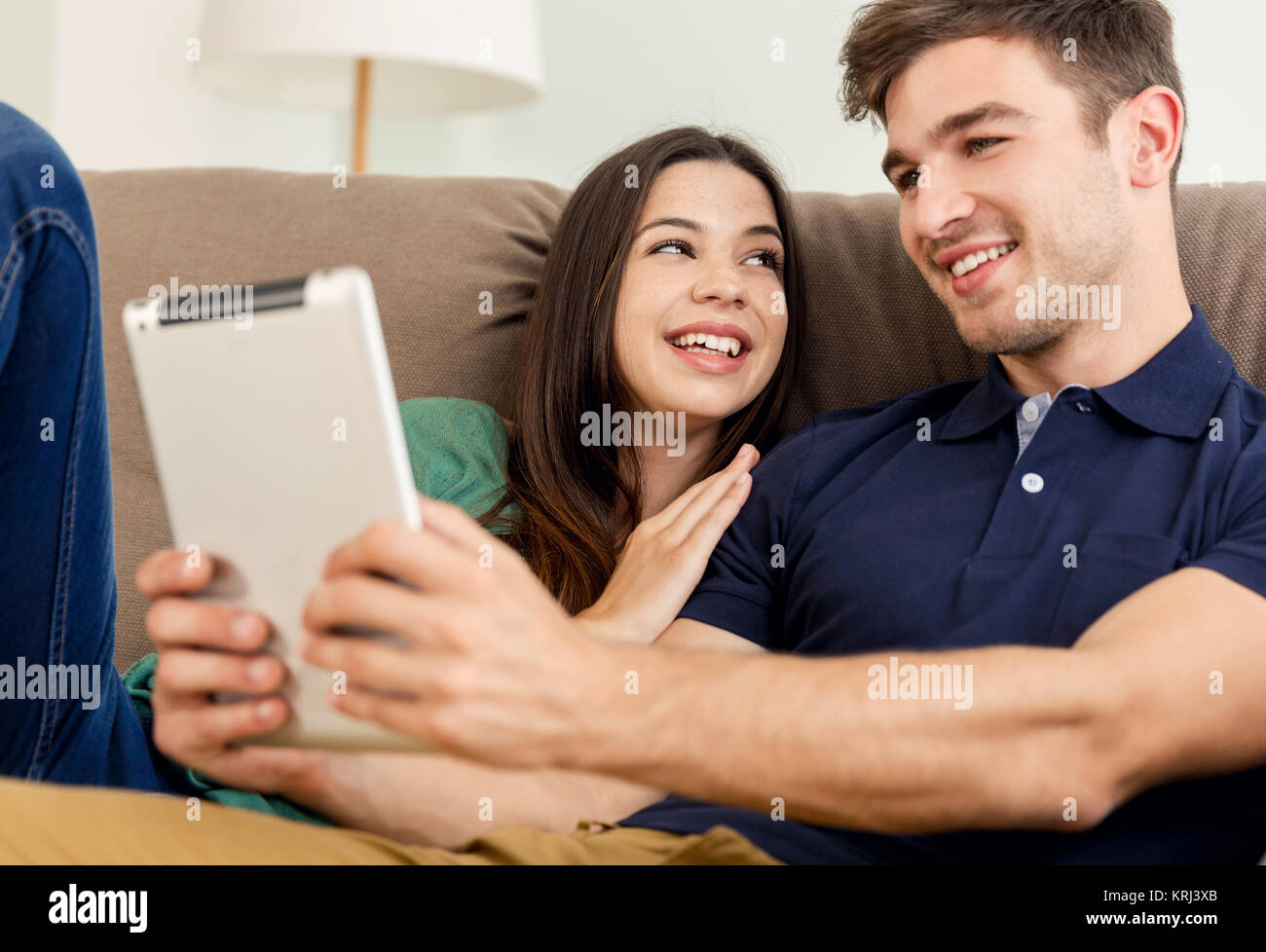 Watching something on a laptop Stock Photo - Alamy
