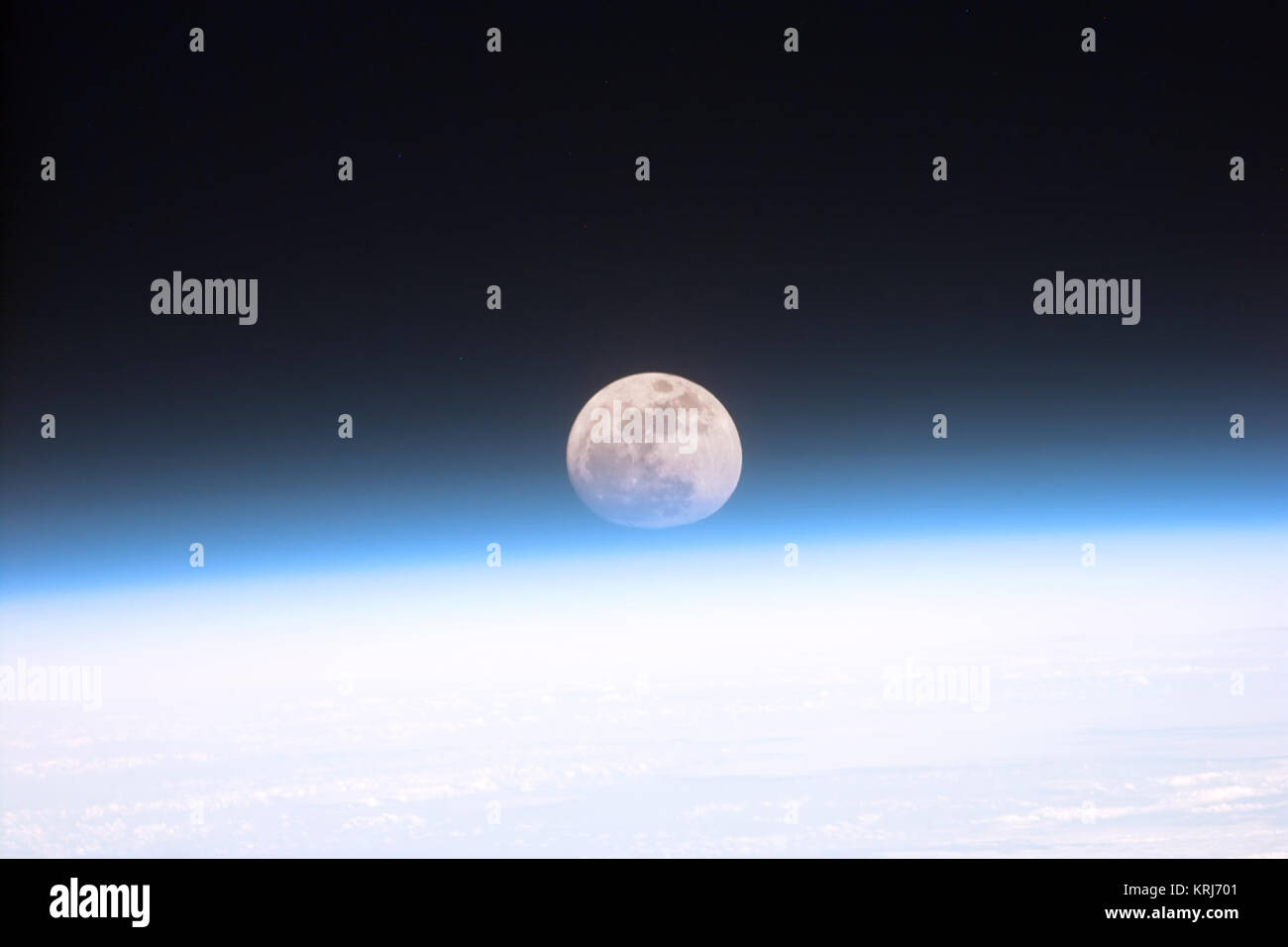 Full moon partially obscured by atmosphere Stock Photo - Alamy