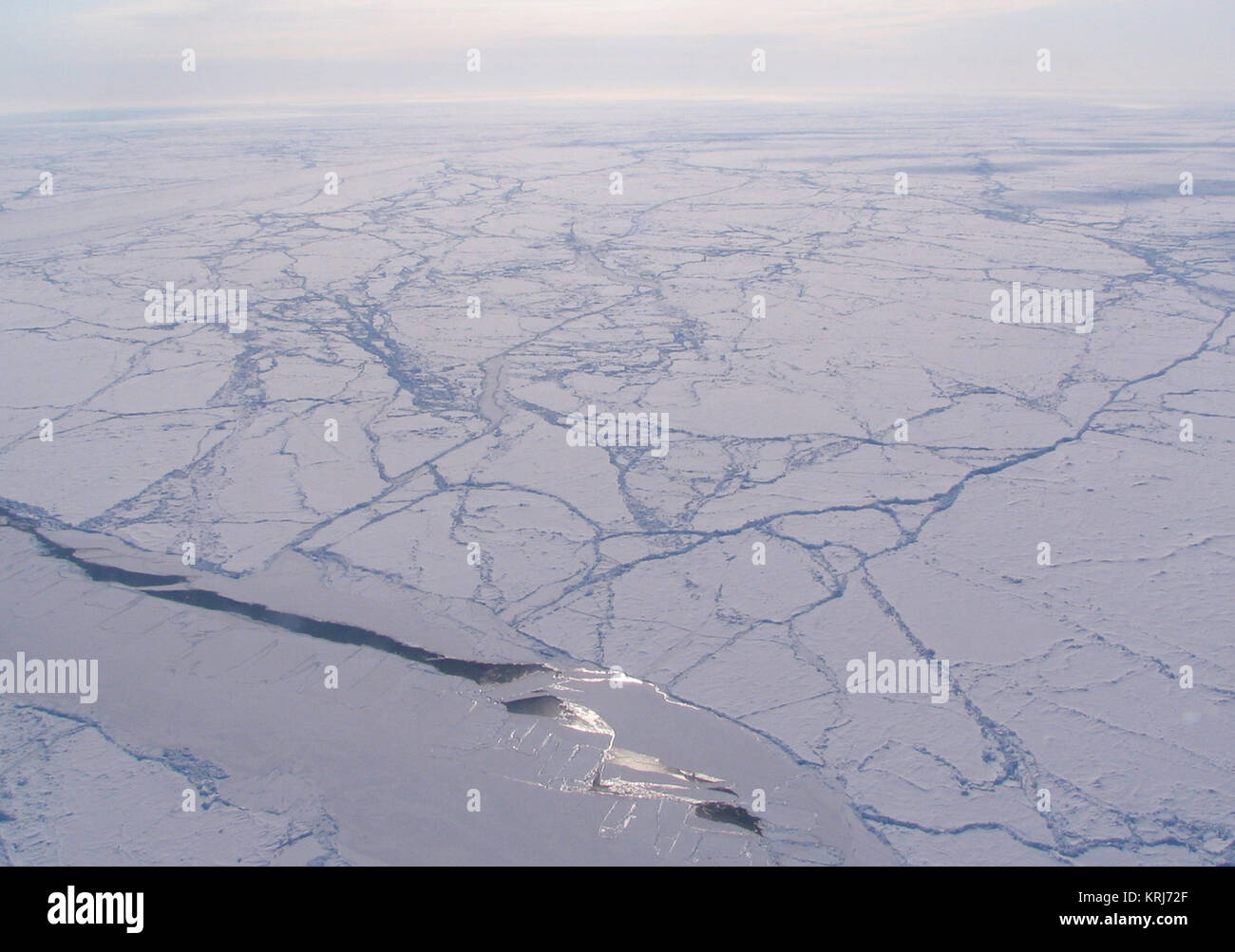 Sun glint off a sea ice lead in an otherwise heavily ridged ice pack ...