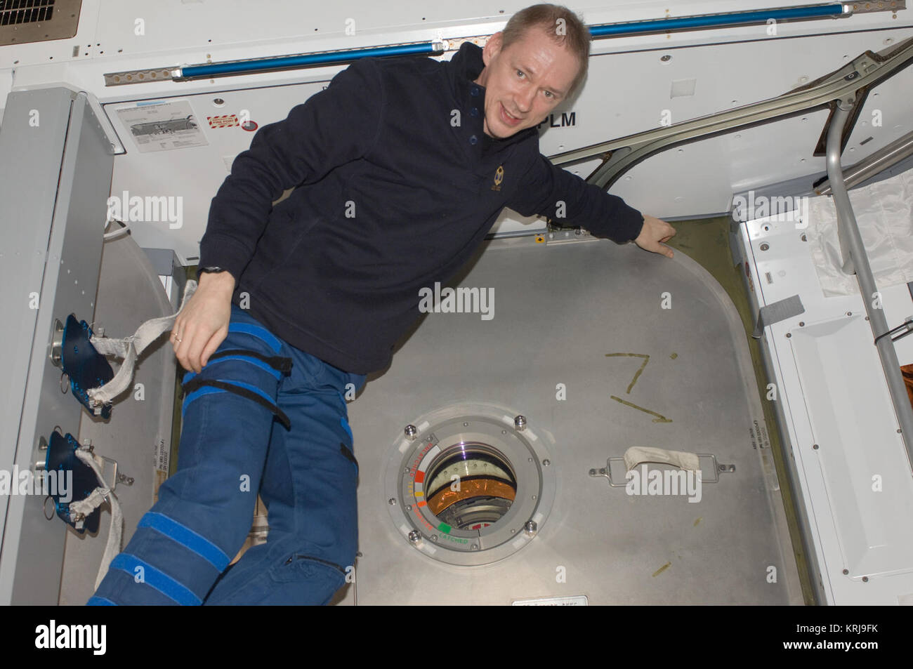 ISS-21 Frank De Winne at the Harmony node nadir hatch during HTV-1 ...