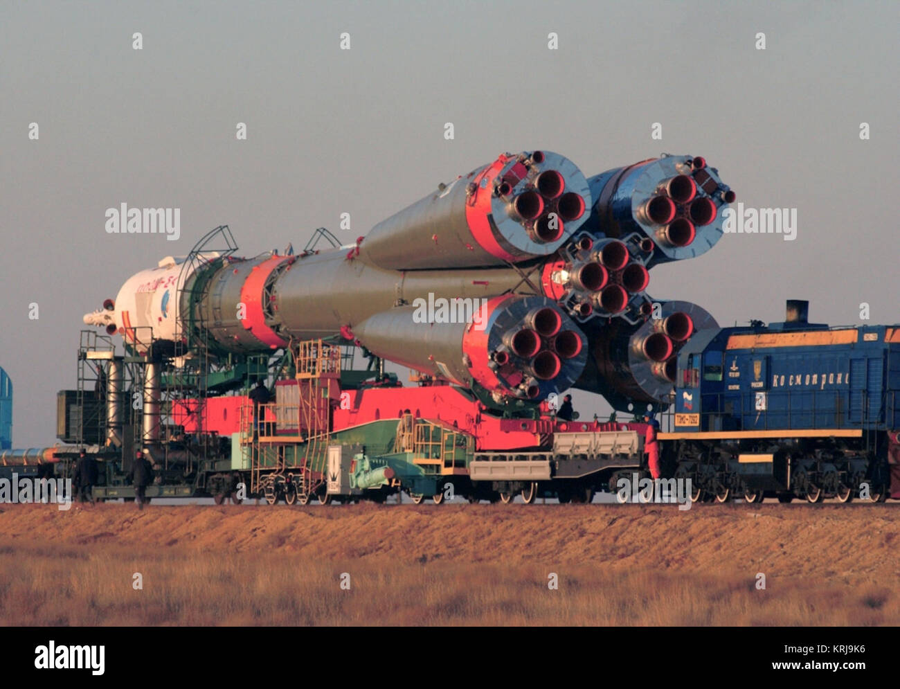 THE SOYUZ TMA-3 SPACE CRAFT AND ITS BOOSTER ROCKET BEING RAILED TO ...