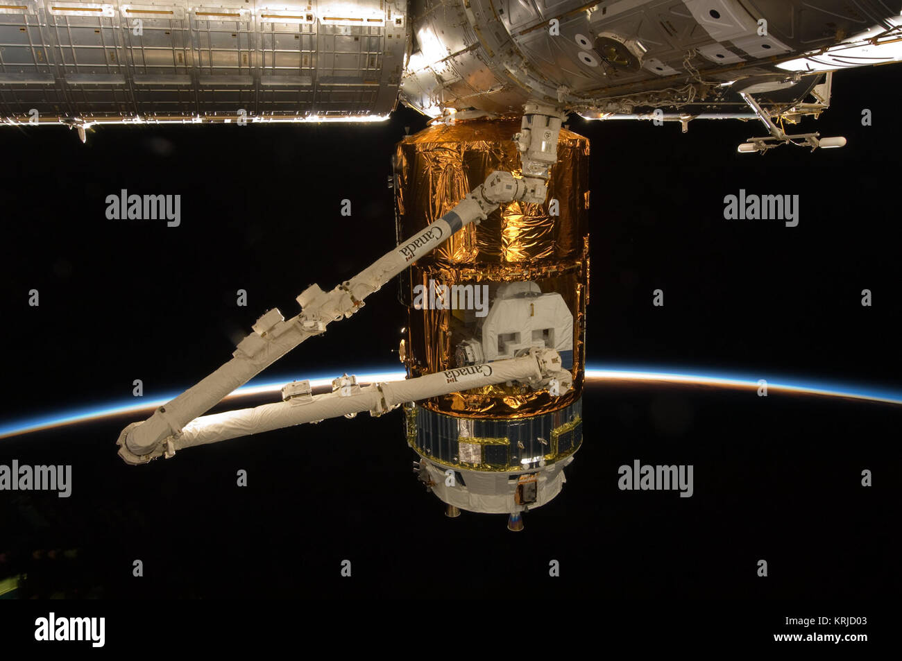 ISS-26 HTV-2 Exposed Pallet grappled by Canadarm2 Stock Photo - Alamy