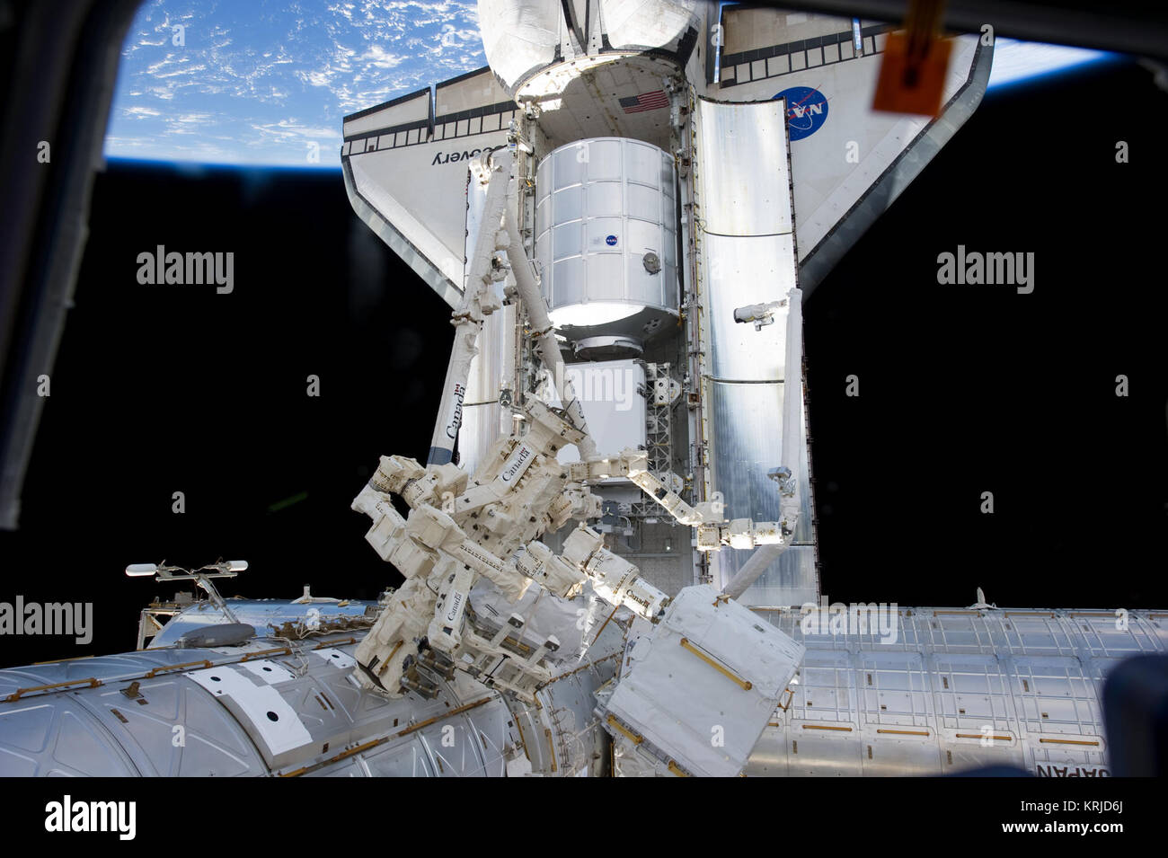 STS-133 Discovery seen from the Cupola Stock Photo - Alamy
