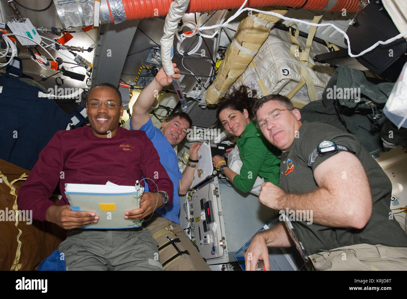 STS-133 crew members on Discovery's middeck Stock Photo - Alamy