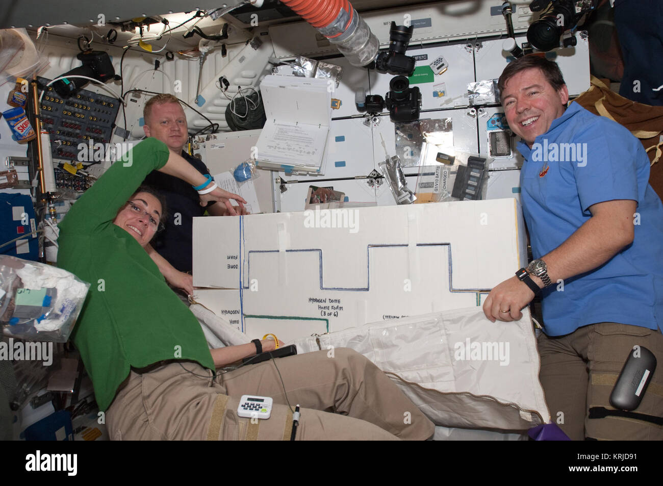 STS-133 Eric Boe, Nicole Stott and Michael Barratt Stock Photo - Alamy