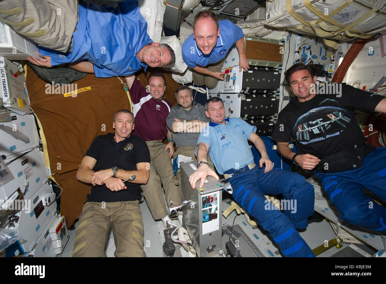 STS-134 and Expedition 28 crew members on the middeck of space shuttle ...